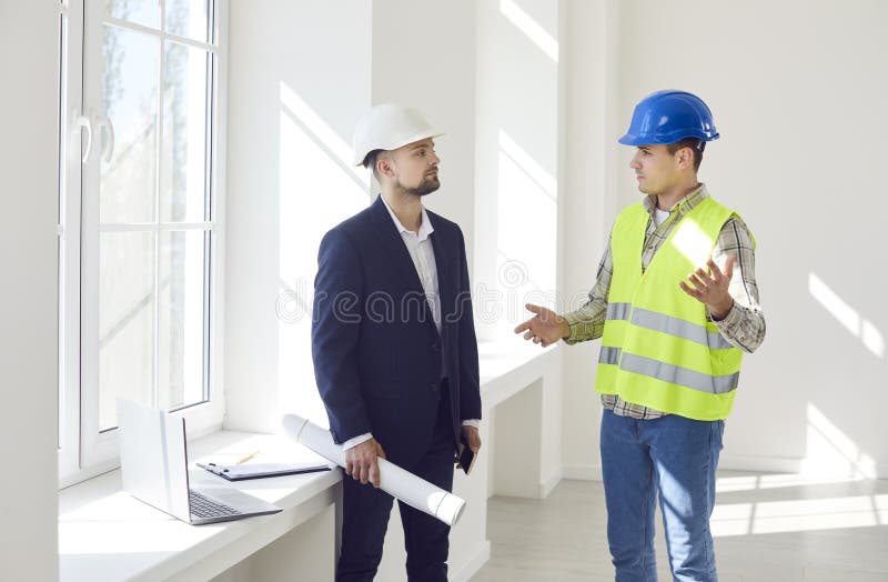 Contractor and Businessman Planning Renovation Together Stock Photo ...