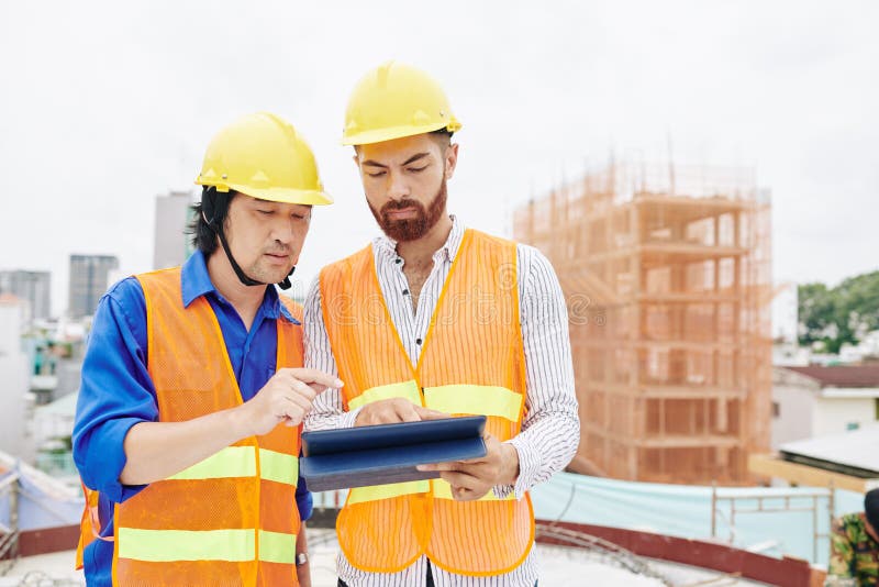 Contractor and Builder Discussing Work Schedule Stock Image - Image of ...