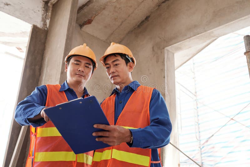 Contractor Checking Construction Progress Report Stock Image - Image of ...