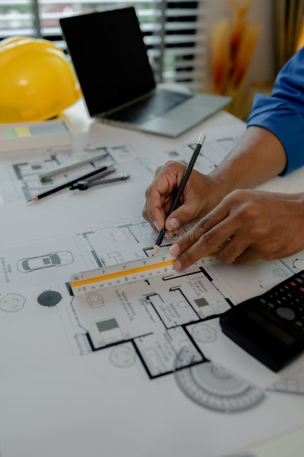 A Contractor is Checking the First Draft in His Office, Architect is ...