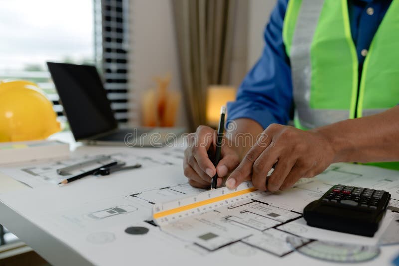 A Contractor is Checking the First Draft in His Office, Architect is ...