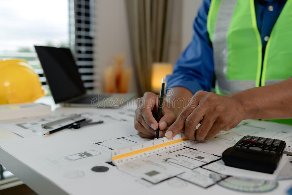 A Contractor is Checking the First Draft in His Office, Architect is ...