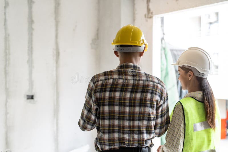 Contractor and Engineer Inspecting Material in Construction Building ...