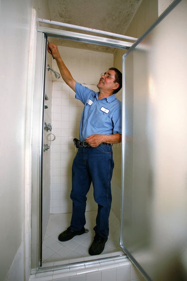 Contractor fixing shower stock image. Image of happy, open - 4807347