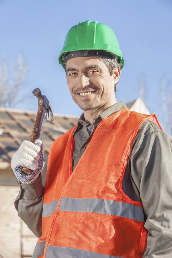 Contractor with hammer stock photo. Image of standing - 63483796