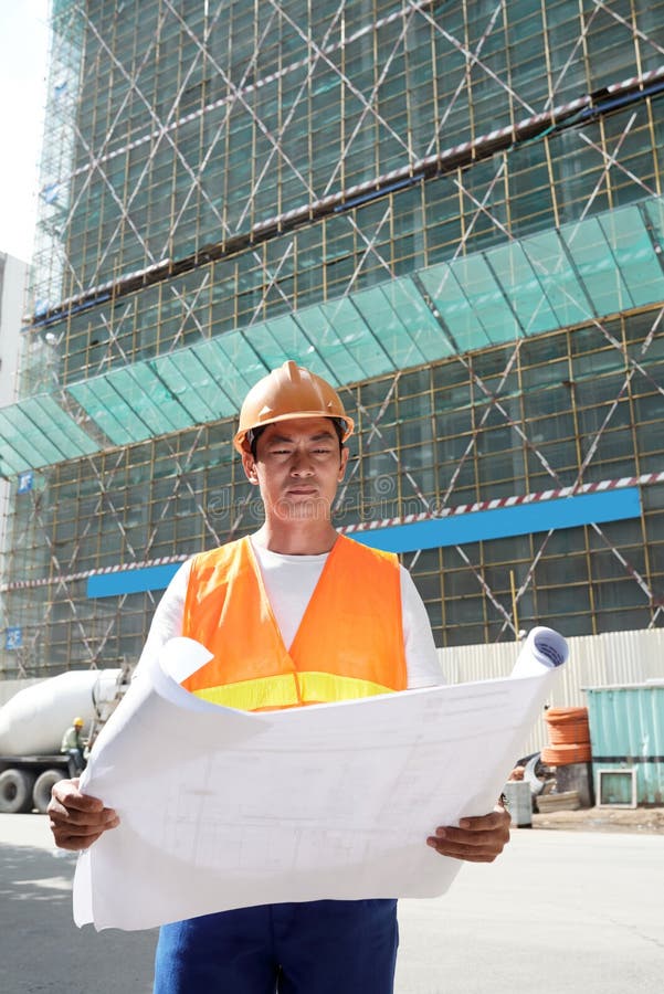 Contractor Rolling Out Construction Plan Stock Image - Image of ...