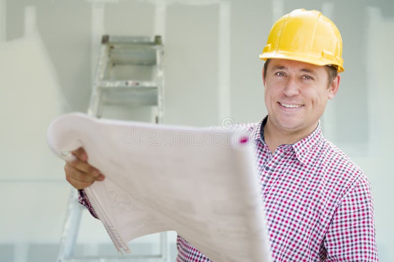 Contractor Holding Blueprints Inside Home Construction Site Stock Image ...