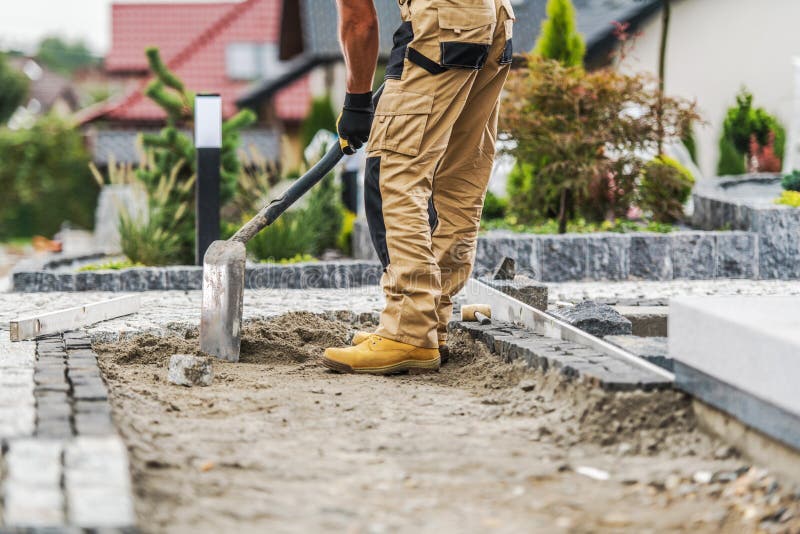 Contractor Laying a Brick Paving Path Stock Photo - Image of work ...