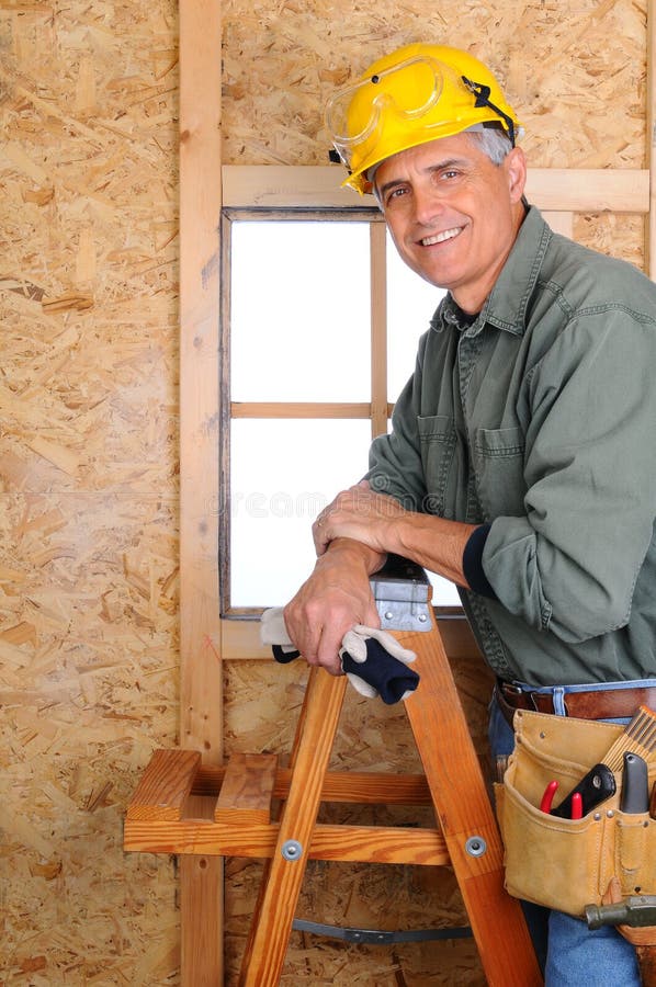 Contractor Leaning on Ladder Stock Photo - Image of construction, jeans ...