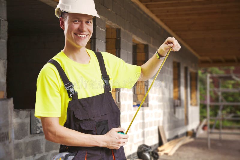 Contractor Measuring at Construction Site Stock Image - Image of safety ...