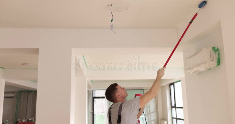 Contractor Paints Ceiling with Roller Brush on Long Handle Stock Video ...