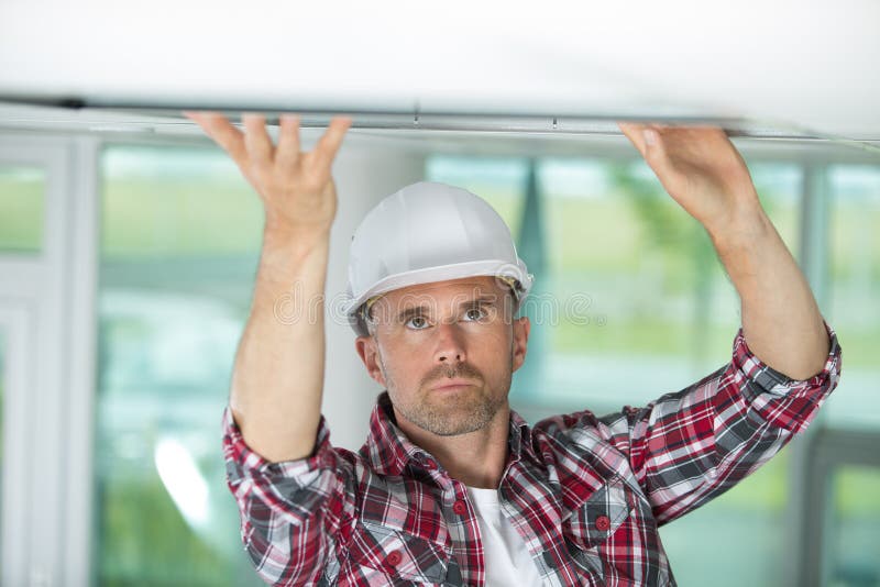 Contractor Putting Ceiling Panel in Place Stock Image - Image of male ...