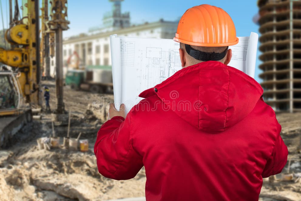 Contractor reading plans stock photo. Image of manual - 27379946