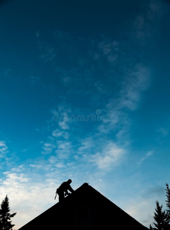 Contractor in Silhouette Working on a Roof Top Stock Photo - Image of ...
