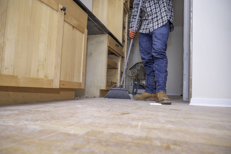 Contractor Sweeping Floor during Home Remodel Stock Photo - Image of ...