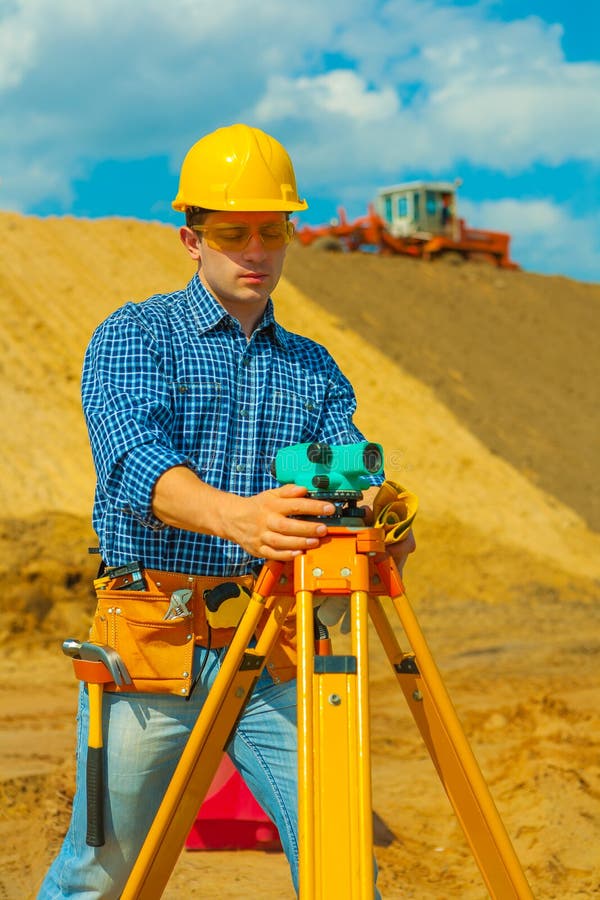 A worker with theodolite stock photo. Image of inspector - 31283478