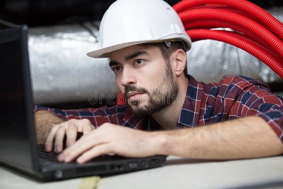Contractor Using Laptop in Roofspace Stock Photo - Image of examine ...