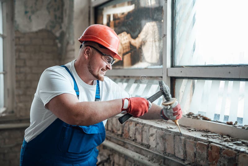 Contractor Wielding a Hammer To Destroy Old Brick Walls Stock Photo ...
