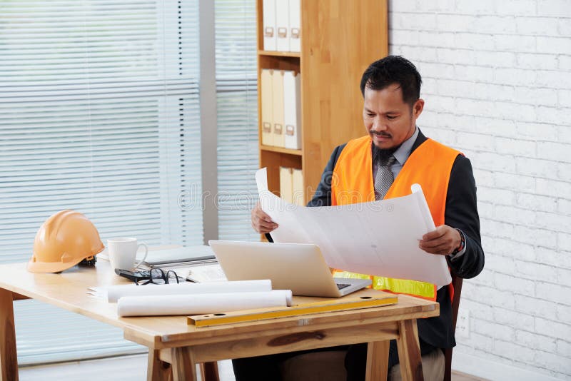 Contractor Working with Documents Stock Photo - Image of expertise ...