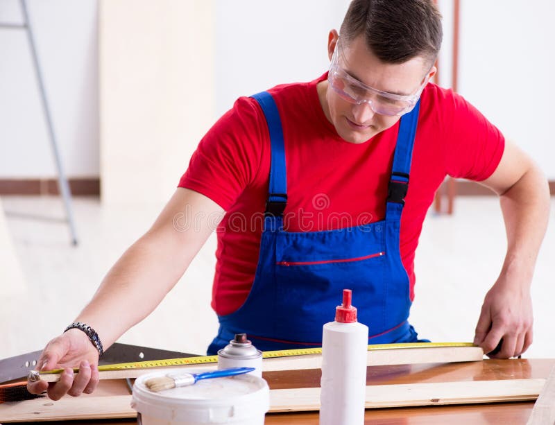 Contractor Working in the Workshop Stock Photo - Image of coveralls ...