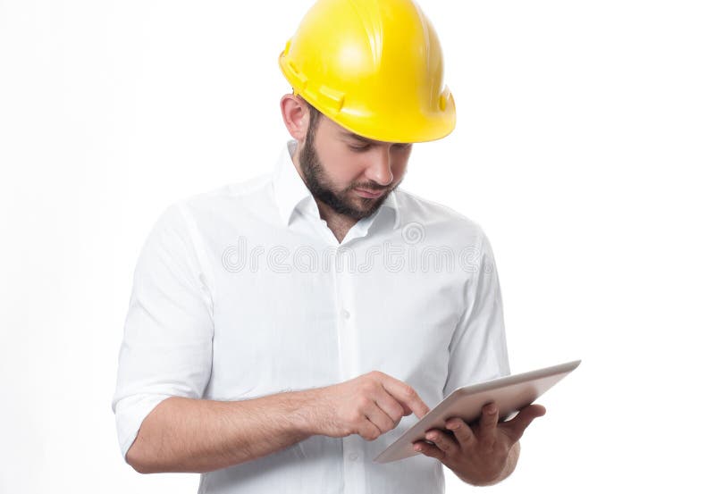 Contractor in Yellow Builder Helmet Working on a Project with Tablet ...