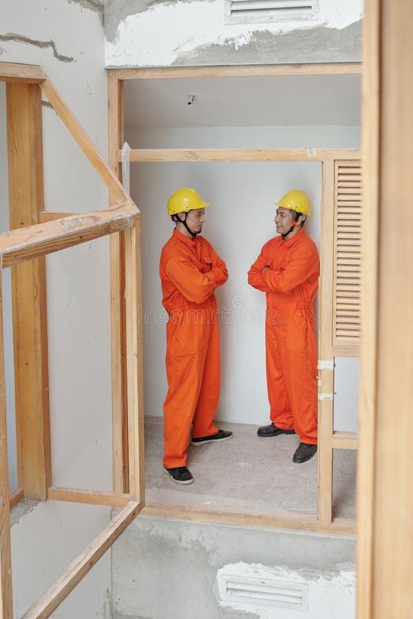 Contractors Discussing Rennovation Process Stock Photo - Image of ...