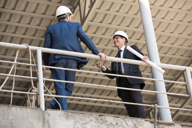 Contractors in Formal Wear Talking on Construction Site Stock Photo ...
