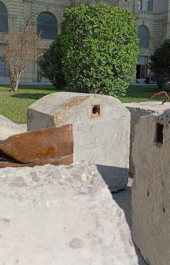 Contrasting Elements: Cement Blocks and Classical Architecture Amidst ...