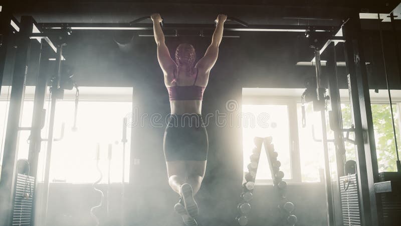 Contre-jour Aesthetic Shot: a Strong Woman Training with Pullups ...