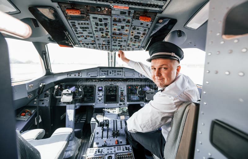 Control of the Flight. Pilot on the Work in the Passenger Airplane ...