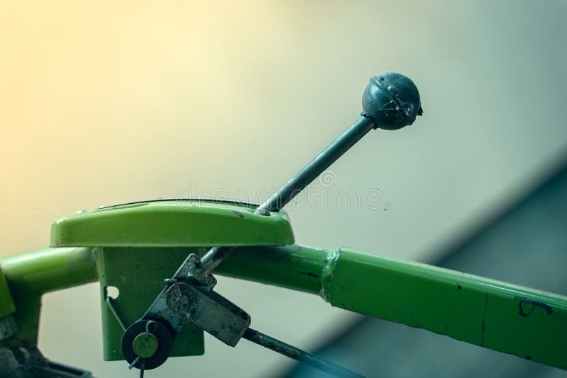 The Control Lever on a Walk-behind Tractor Close-up on a Blurred ...