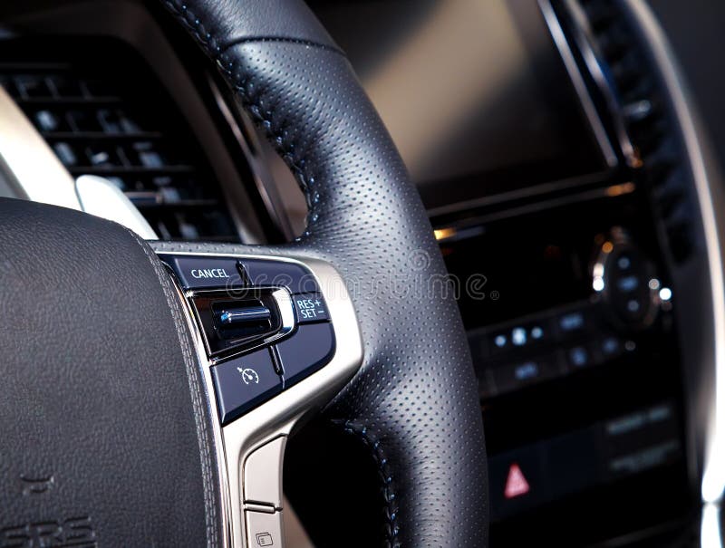 Control Panel with Buttons on a Black Leather Wheel of Modern Car Stock ...