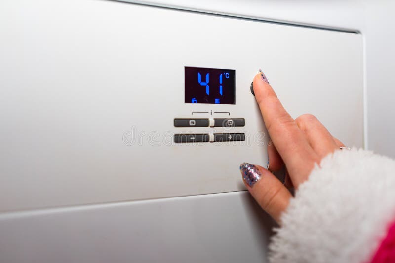 Control Panel of Central Heating. Hand Adjusting the Room Temperature ...