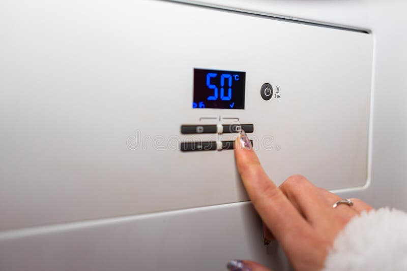 Control Panel of Central Heating. Hand Adjusting the Room Temperature ...