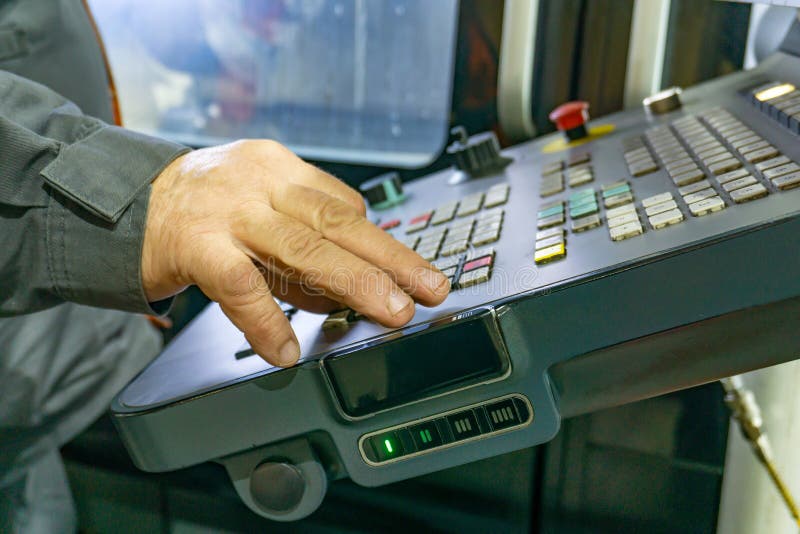 The Control Panel of a CNC Machine, a Worker Writes a Program for ...