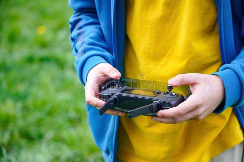 The Control Panel is in the Hands of the Boy Who Controls the Drone ...