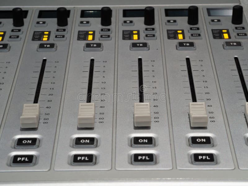 Control Panel in a Sound Studio Featuring Multiple Faders and Buttons ...