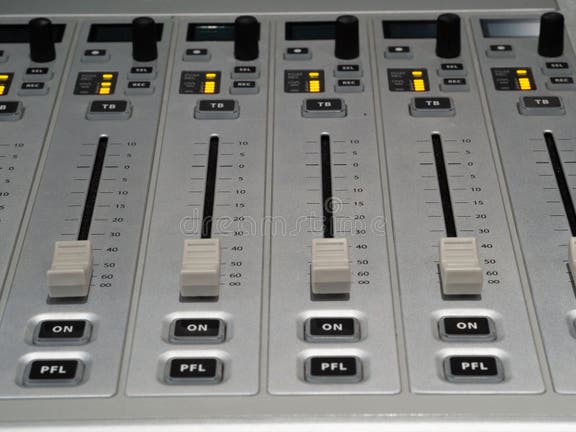 Control Panel in a Sound Studio Featuring Multiple Faders and Buttons ...