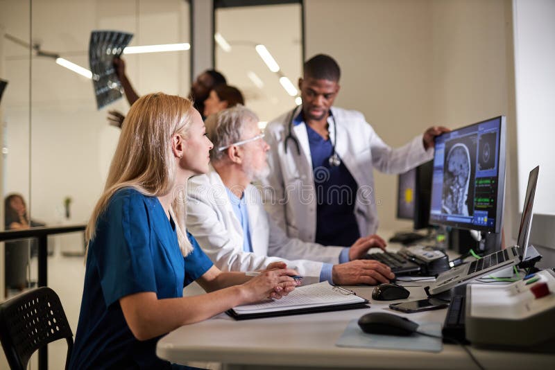 In Control Room Doctors and Radiologists Discuss Diagnosis while ...