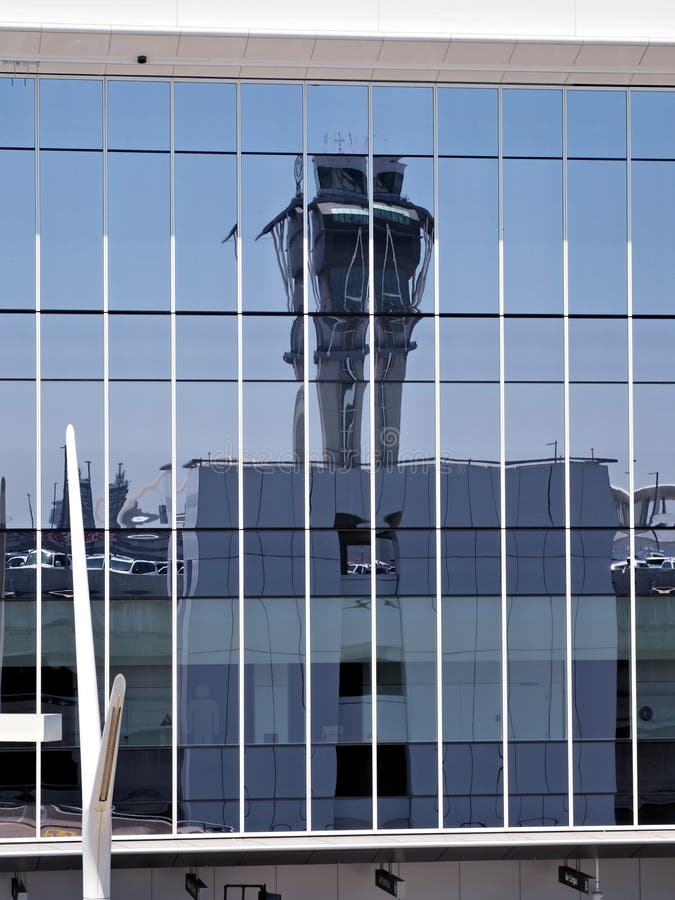 The Control Tower at Los Angeles International Airport is Reflected in ...