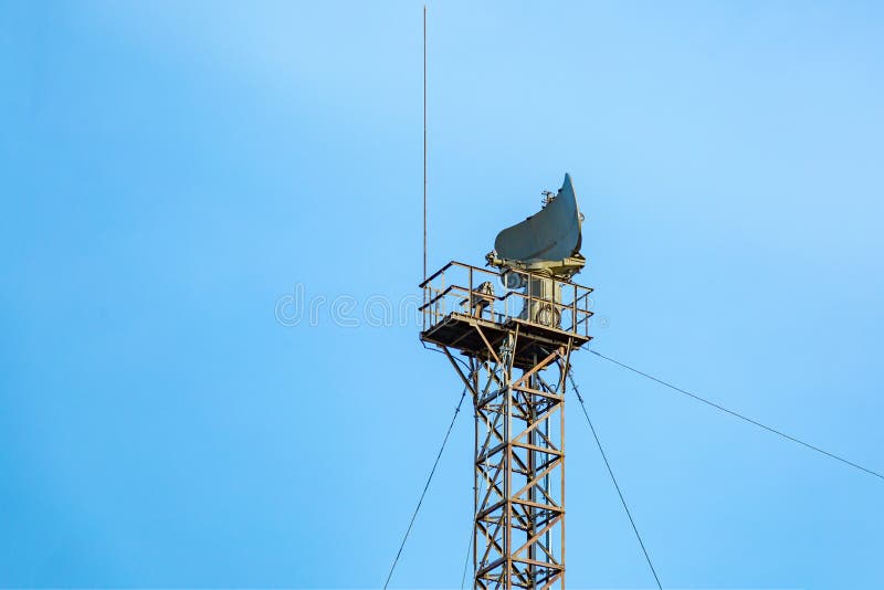 Control Tower with Radar Antenna and Navigation Equipment Against the ...
