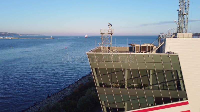 Control Tower of Ships with Big Cargo Ship Entering the Port at the ...