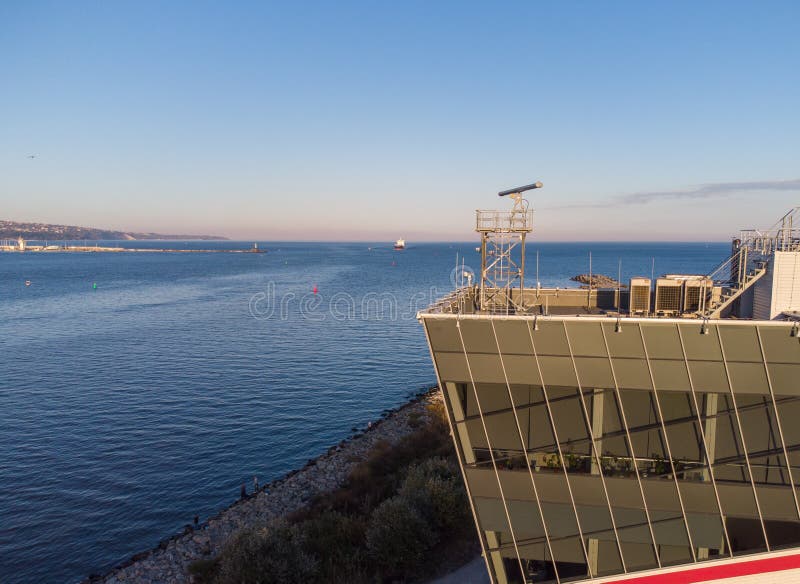 Control Tower of Ships with Big Cargo Ship Entering the Port at the ...