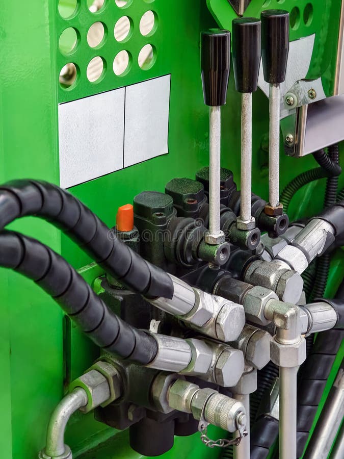 Hydraulic System Components Displayed in a Green Machine with Various ...