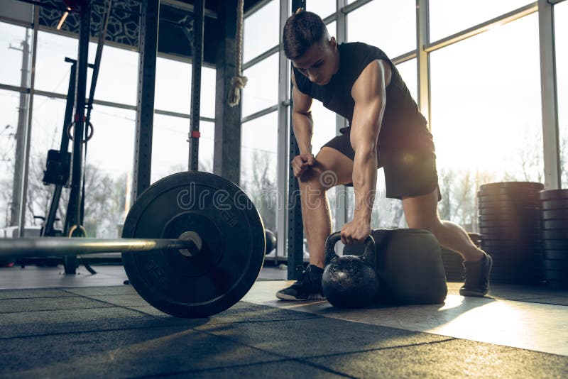 The Male Athlete Training Hard in the Gym. Fitness and Healthy Life ...