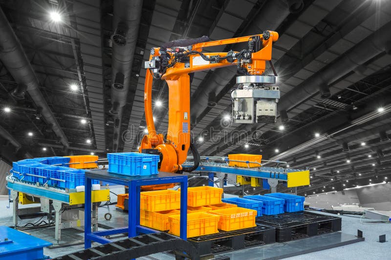 An Industrial Robotic Arm Works in a Hightech Manufacturing Facility ...