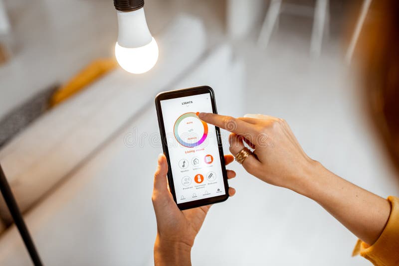Smart Home: Man Controlling Lights with App on His Phone. Electric ...