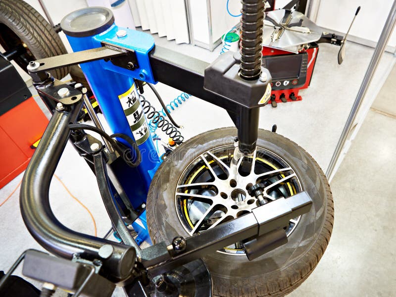 Tire changer wheel stock photo. Image of changer, maintenance - 229928508