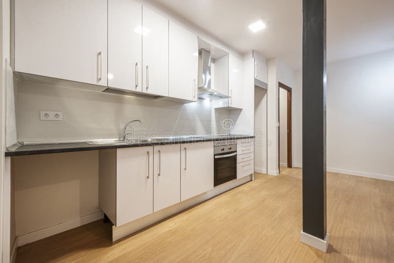 Conventional Kitchen Cabinets Just Installed in an Open Kitchen with a ...