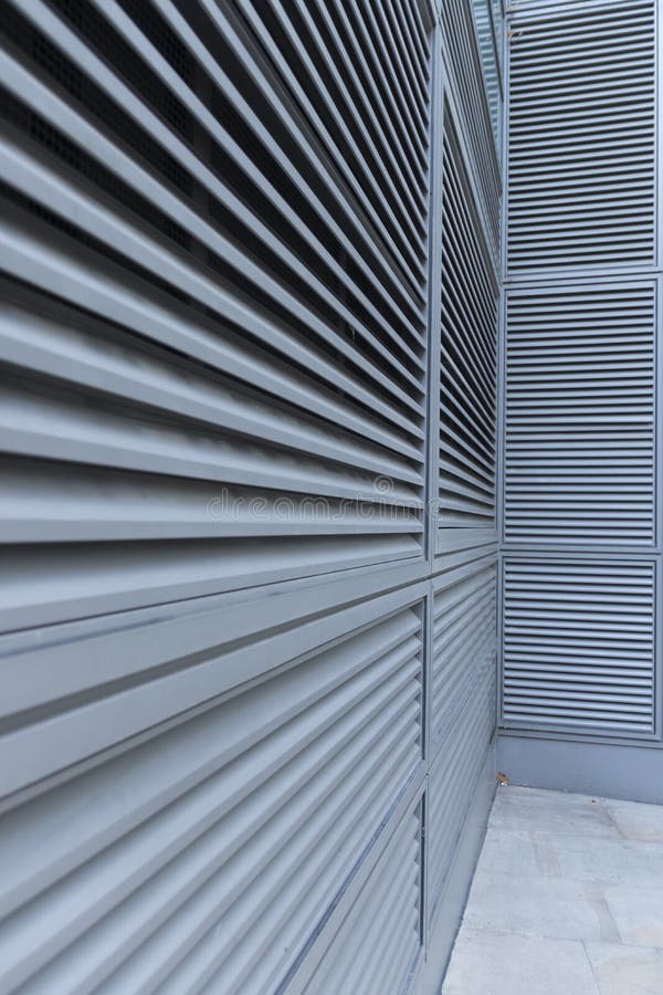 Converging Lines on an Office Building Grilled Cladding Stock Photo ...